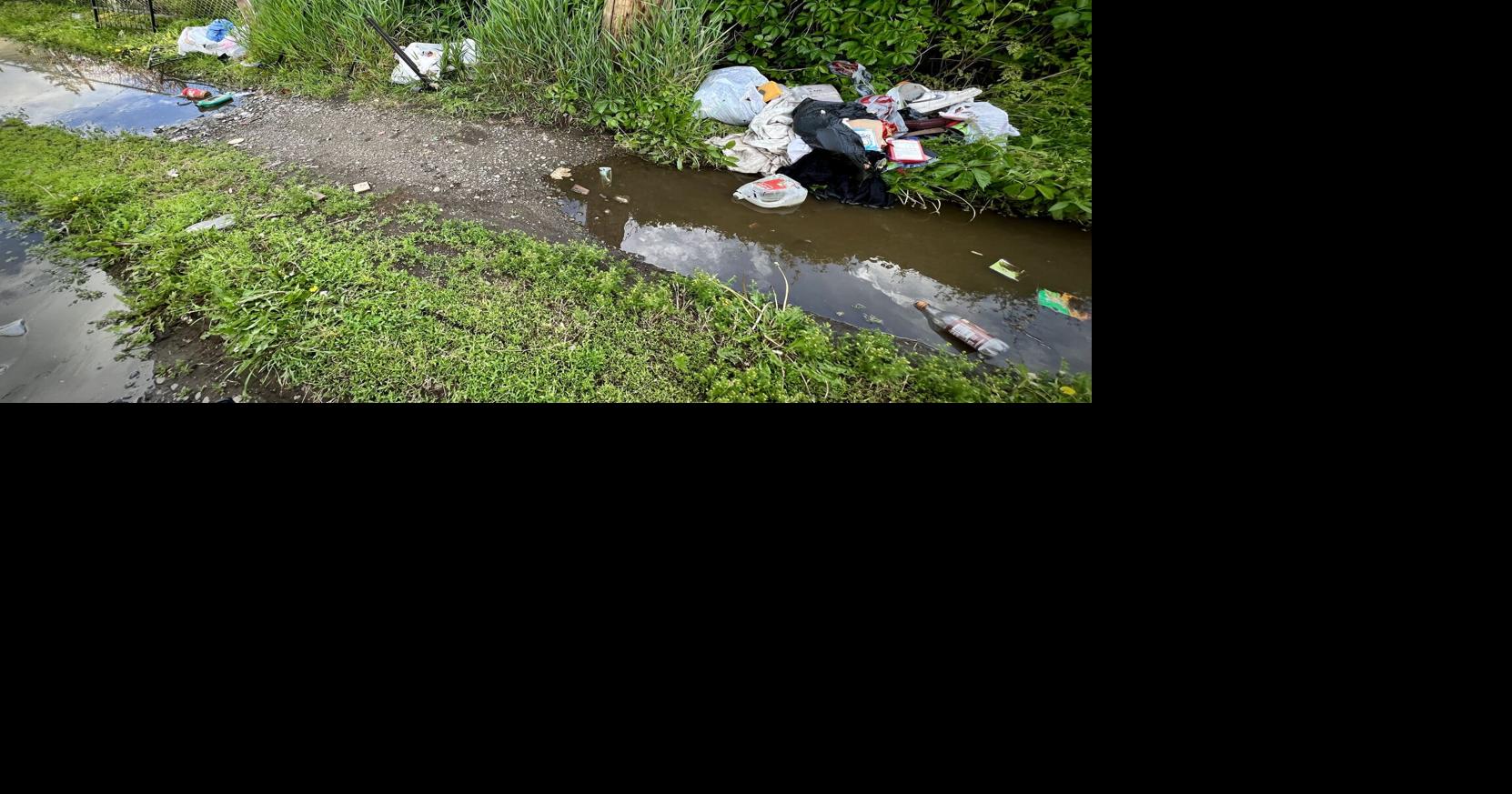 VIDEO: Garbage flies off unsecured trailer, littering garbage in ...