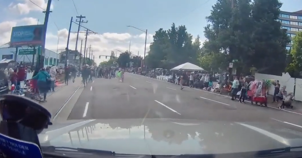 Dash camera video shows man driving through parade during road rage ...