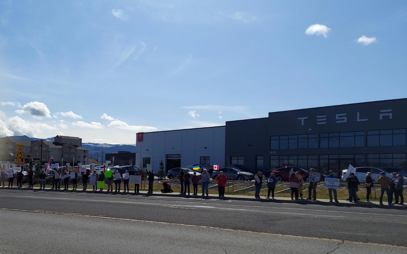 Protest against Elon Musk takes place at Liberty Lake Tesla dealership ...