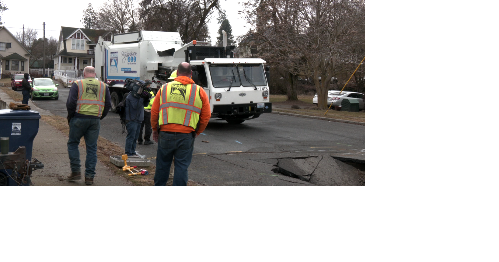 City of Spokane solid waste truck falls into hole after pipe burst ...