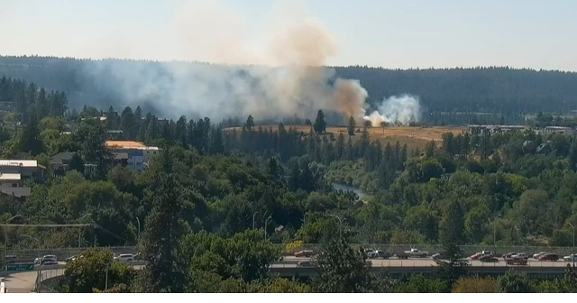 Firefighters battle small brush fire in Spokane north of Maple Street ...