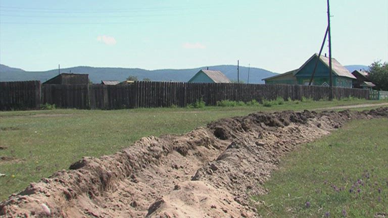 Russian authorities dig trench around remote Siberian village to ...