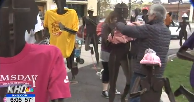 Spokanites adorn Bloomsday runner statues with past t-shirts in quarter ...