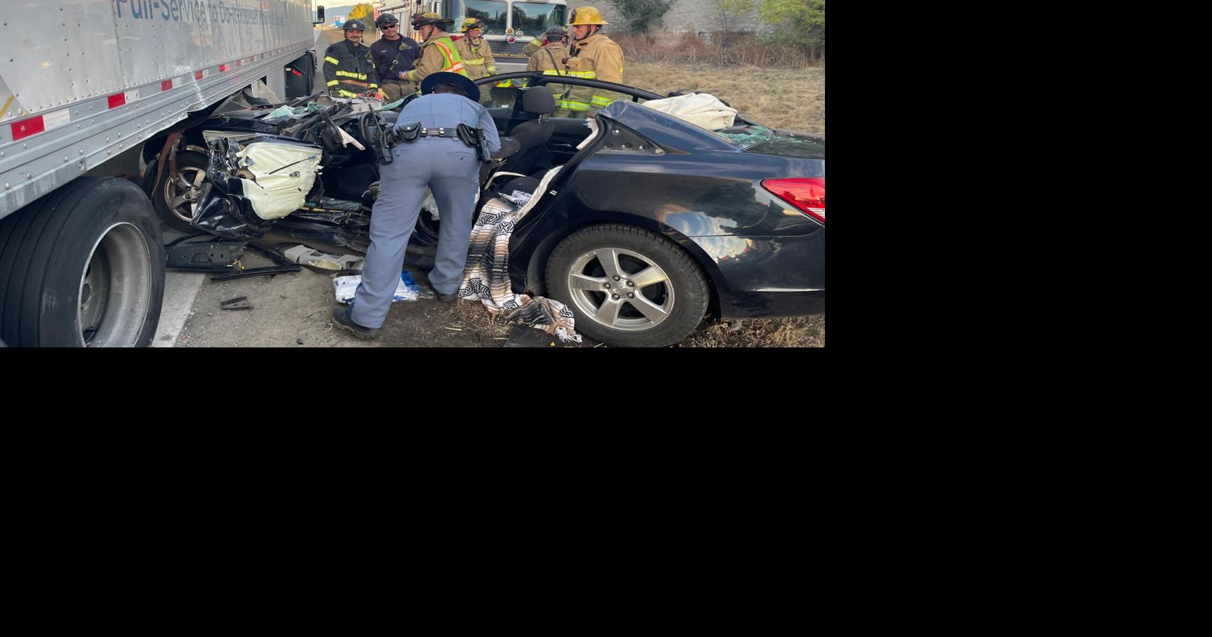 Driver rescued with minor injuries after being pinned under semi-truck ...