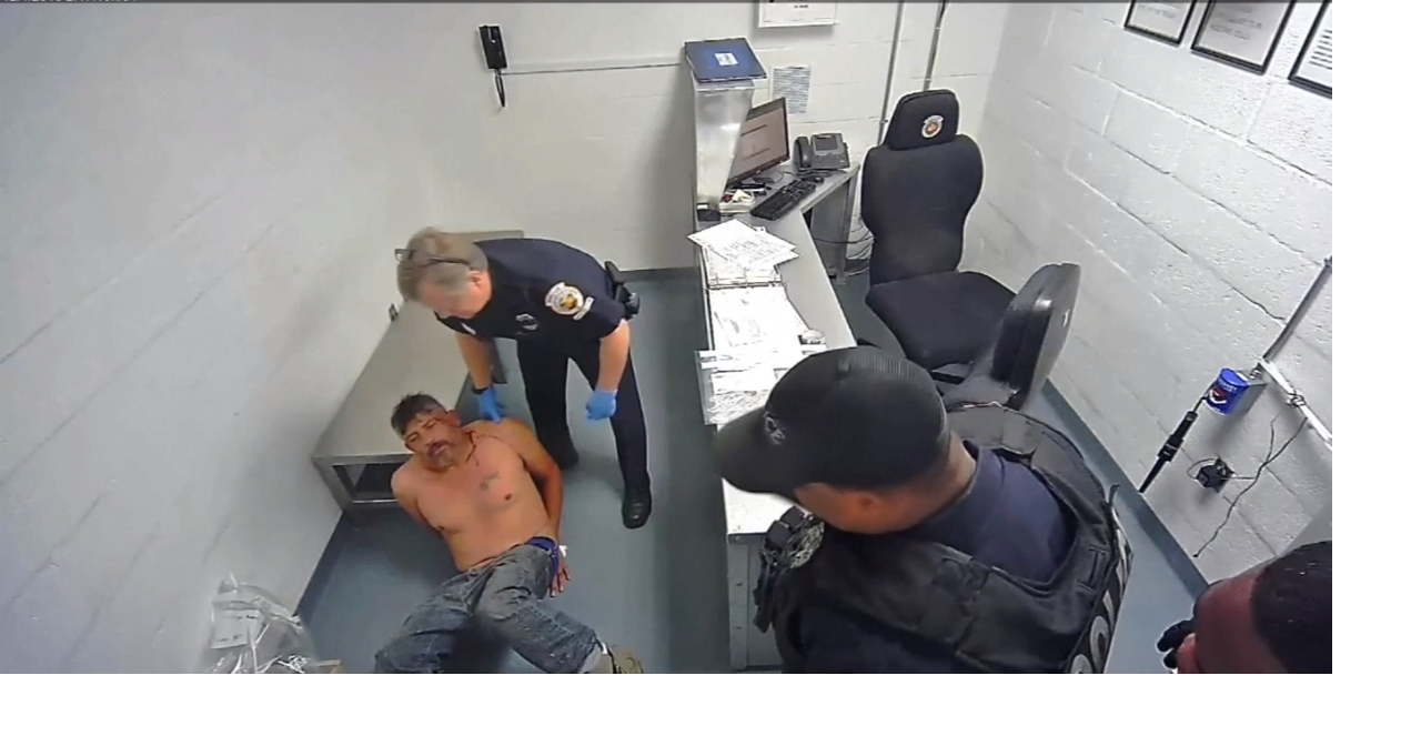 Police officer slams handcuffed inmate into wall | Regional | khq.com
