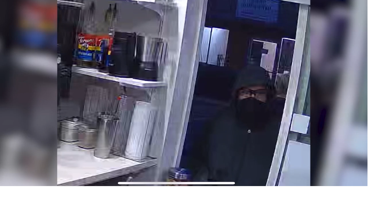 Surveillance video captures armed man robbing coffee stand, law ...