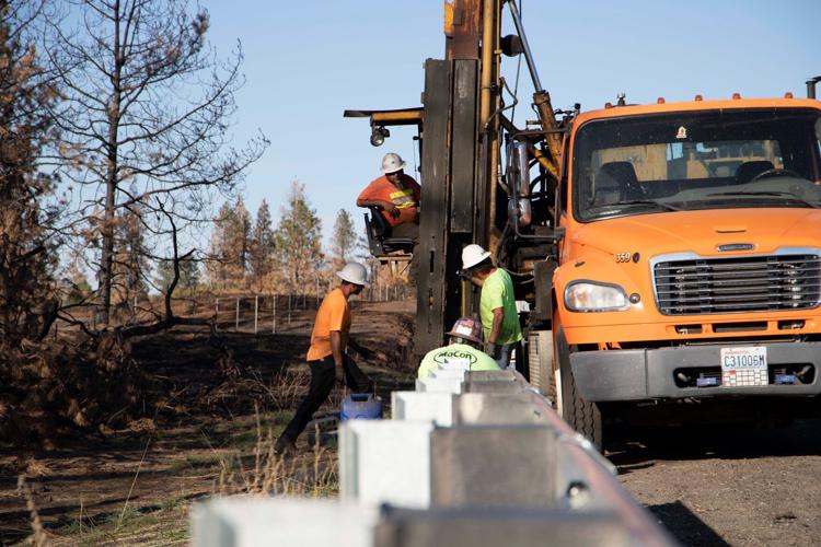 Workers fix guardrail in Medical Lake following Gray fire | | khq.com