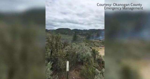 Firefighter crews work to clean up after fire on SR 97 near Malott ...