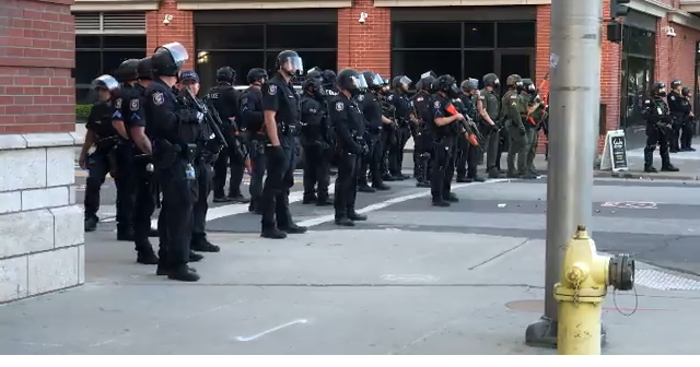 WATCH: Police line up in downtown Spokane to stop violent protesters ...