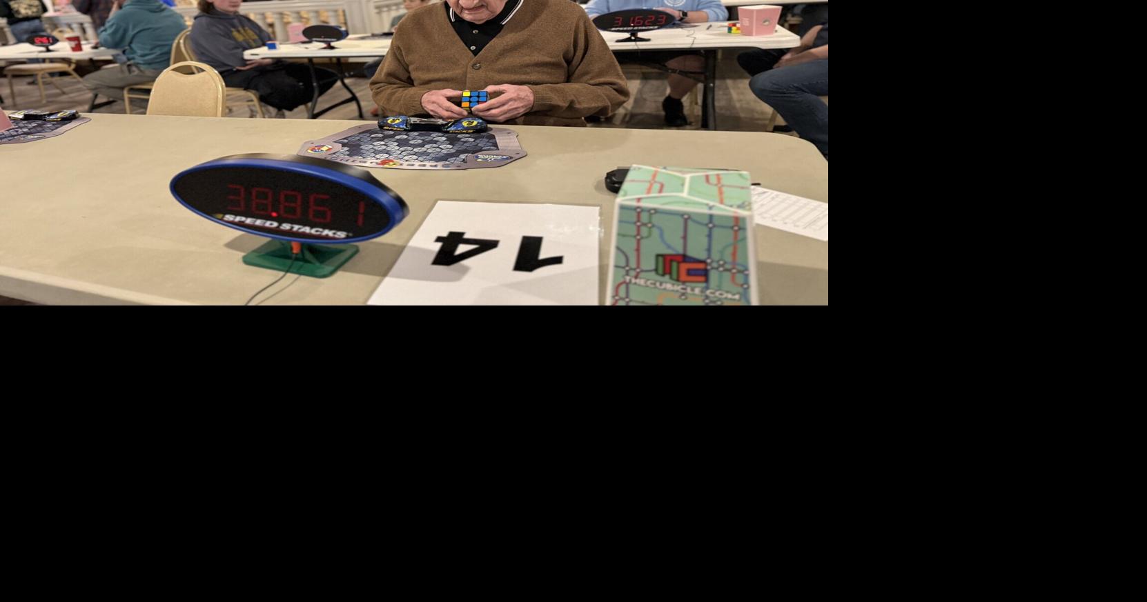 'A world record': 95-year-old man makes history at Rubik's Cube ...