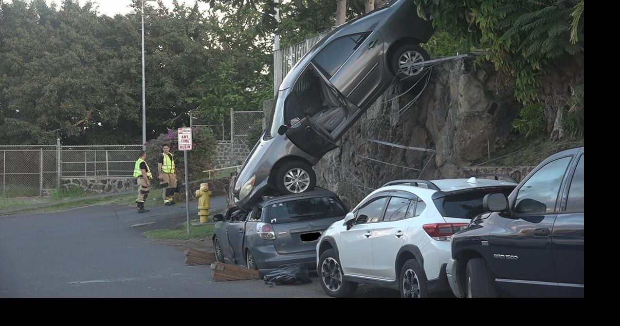 Car goes over cliff, lands on parked car Punchbowl area | Local | kitv.com