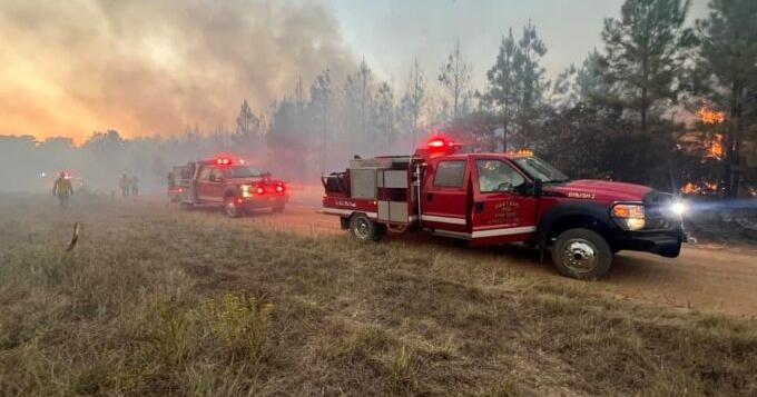 Firefighters continued work on the Mayflower Community fire on ...