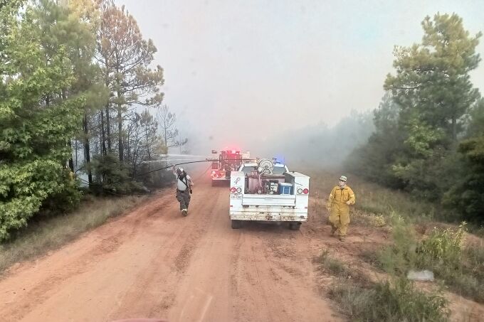 Firefighters continued work on the Mayflower Community fire on ...