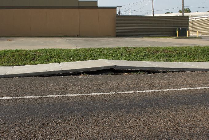 New concrete sidewalk buckles: Who is responsible? | Local News | kjas.com