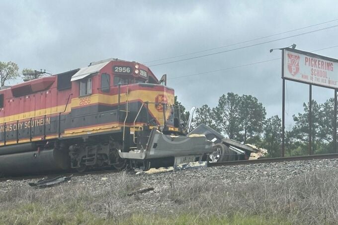 Train hit a big-rig which was stuck on railroad tracks south of ...