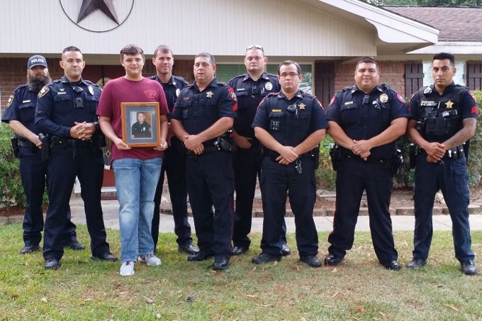 Son of slain police officer escorted to school by cops on first day of ...