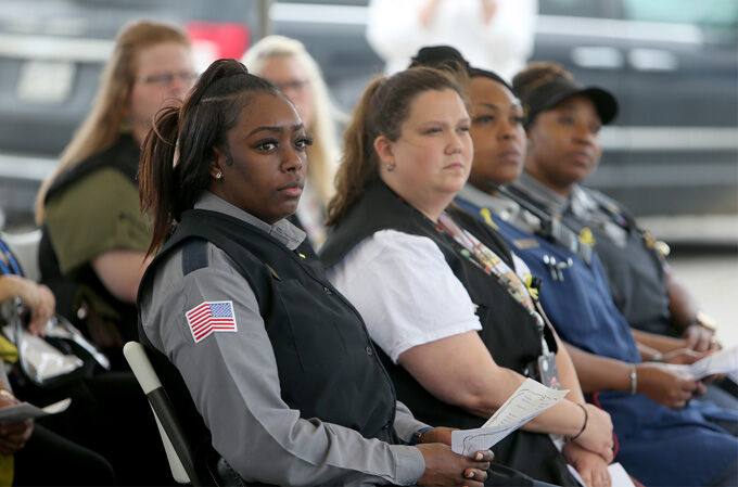 Local corrections officers observe those that have died in their ranks ...