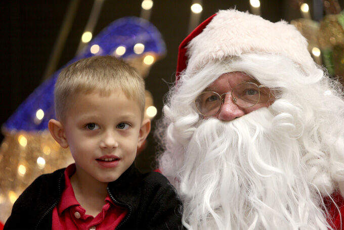 Santa Claus makes a stop at the First National Bank Christmas open ...