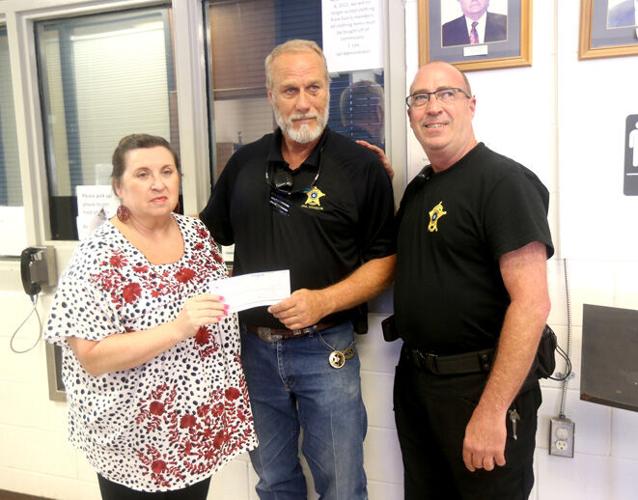 Law enforcement organization gives money local officer who recently ...