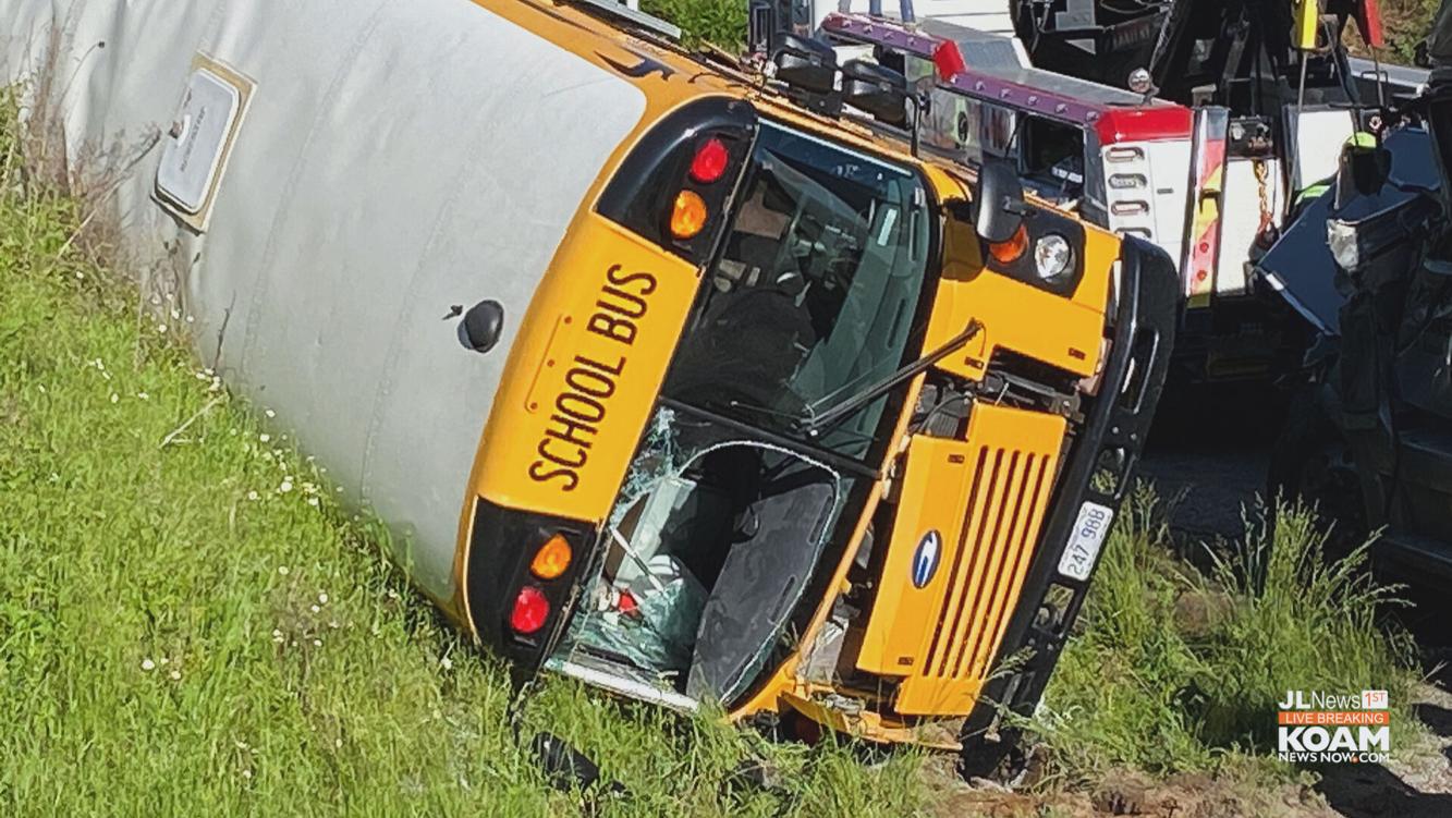 School bus rear-ended by tractor-trailer, bus spun around 180 ...