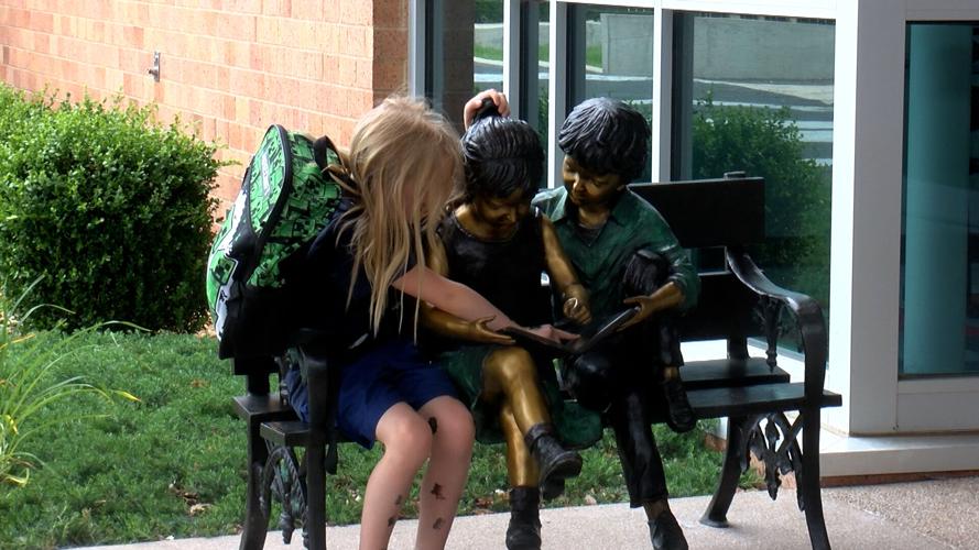 Library welcomes replacement statue after original was taken | Local ...