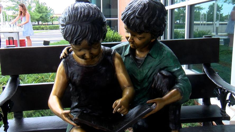 Library welcomes replacement statue after original was taken | Local ...
