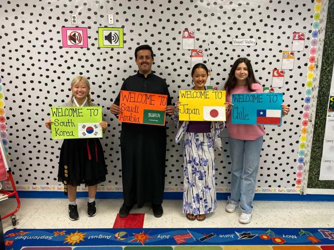 International and kindergarten students spend the day teaching each ...
