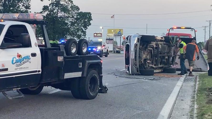SUV clipped from behind, overturns, crashing into N Rangeline car lot ...