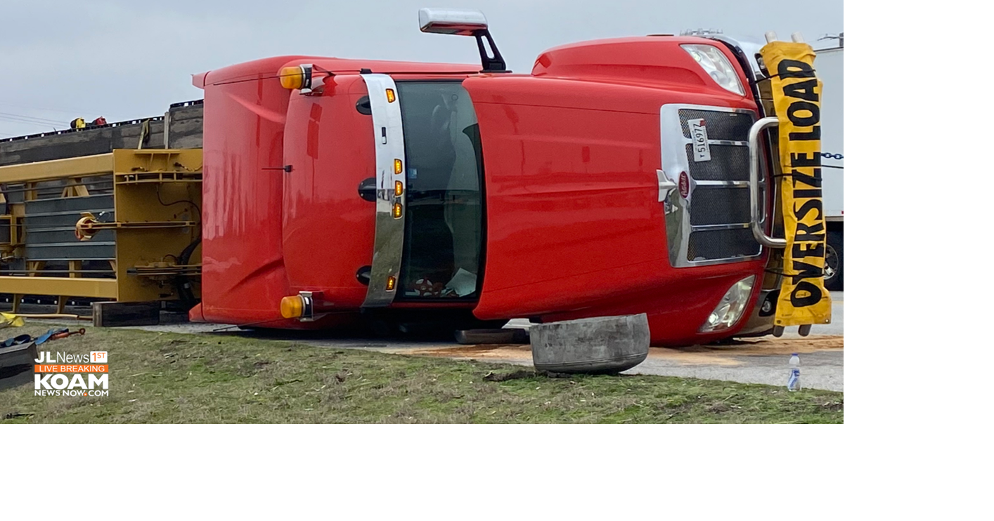 Tractor-trailer hauling oversized load overturns in front of Petro ...