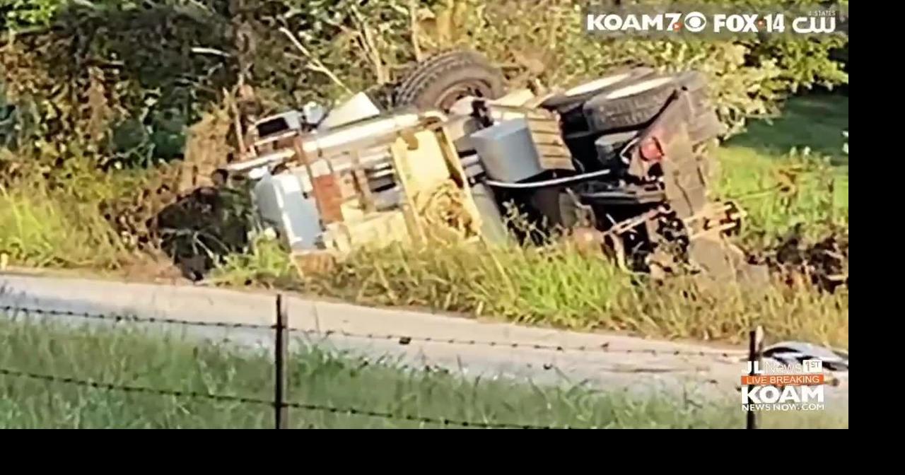 Car runs stop sign, striking semi-truck which then overturns near ...