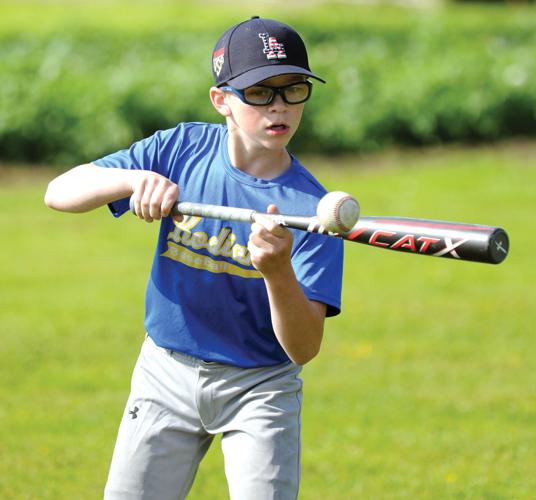 GIVING BACK: Max Floyd shares his baseball knowledge at a free clinic ...