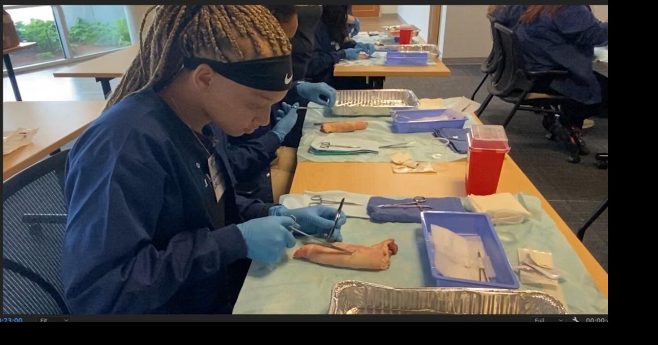 High school students get hands-on suture experience with pig feet ...