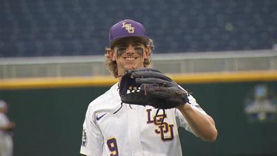 Zach Watson goes from the stands to the field at the College World ...