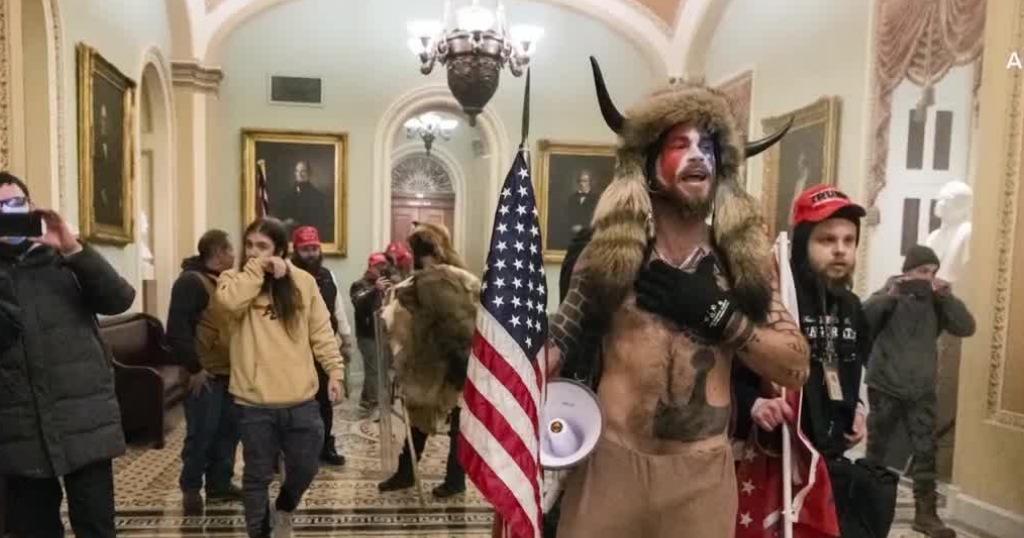 Jake Angeli: The story behind the horned Arizona protester in the ...