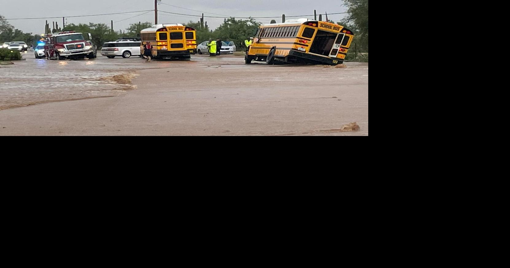 Nearly 30 people rescued after school bus get stuck on flooded road in ...