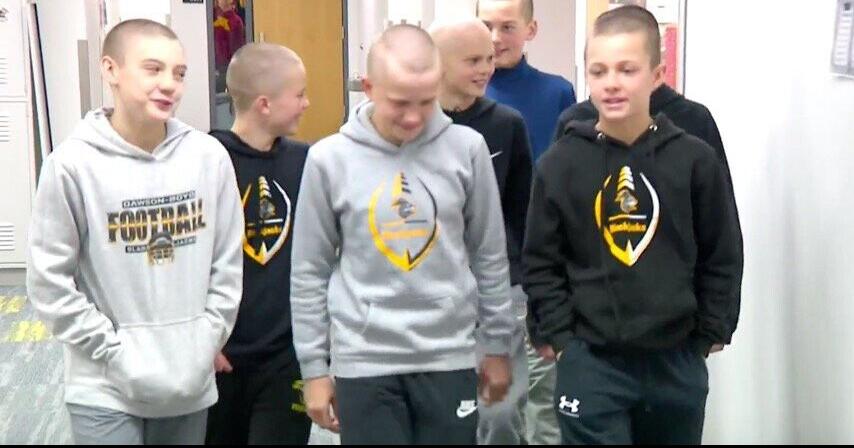 Minnesota fathers, sons shave heads in solidarity with classmate with ...