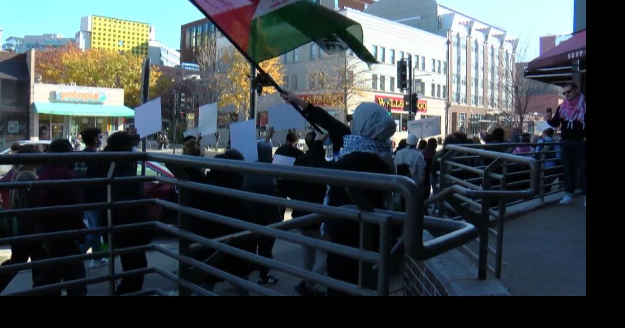 Demonstrators at Iowa City rally stand in solidarity with those in ...