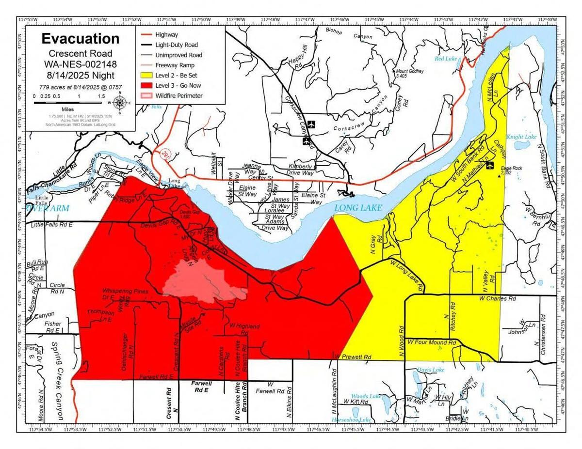 Firefighters work to slow forward progress on fire near the border of ...