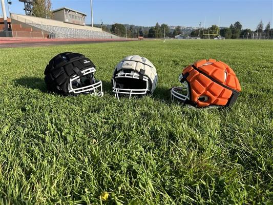 High school football teams adopt Guardian Caps despite mixed research ...