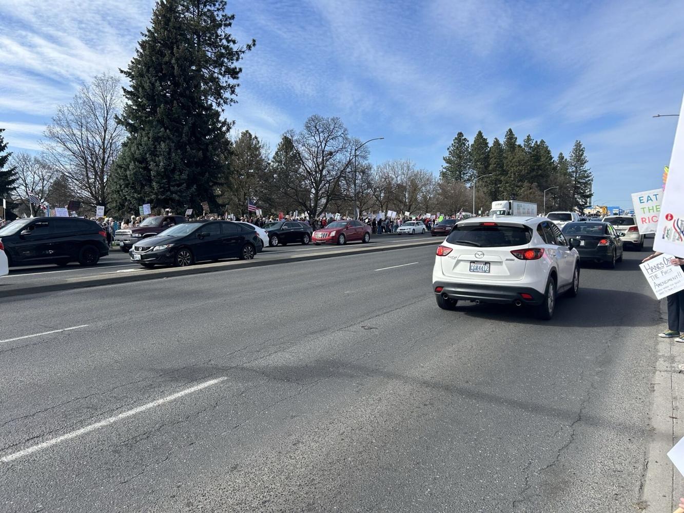 Protest against President Trump and Elon Musk draws hundreds in Spokane ...