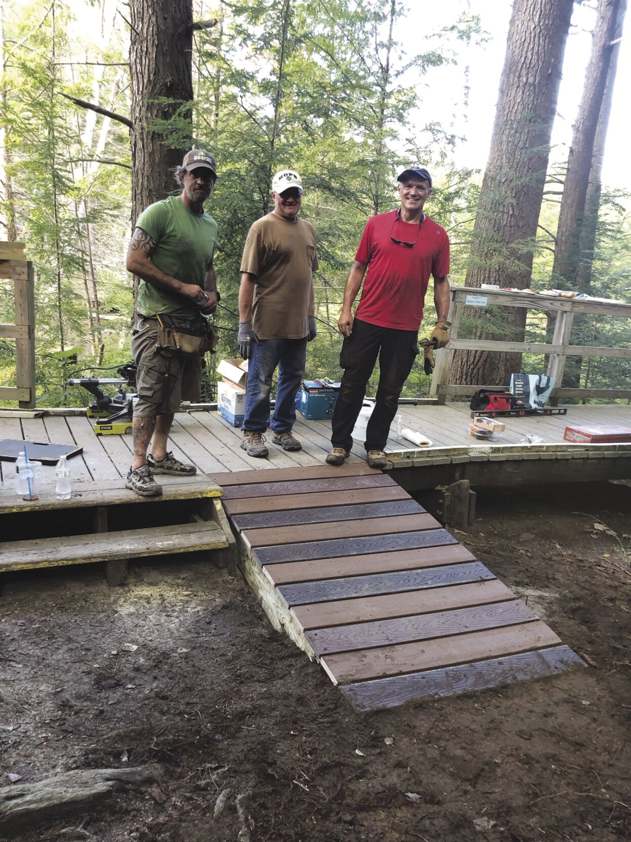 Volunteers install new ramp to Wetlands Walk's boardwalk ...