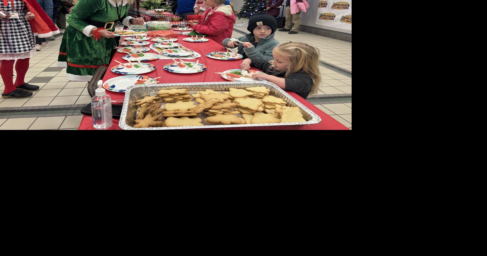 Weather can't stop the holiday fun at Children's Auction Family Night ...