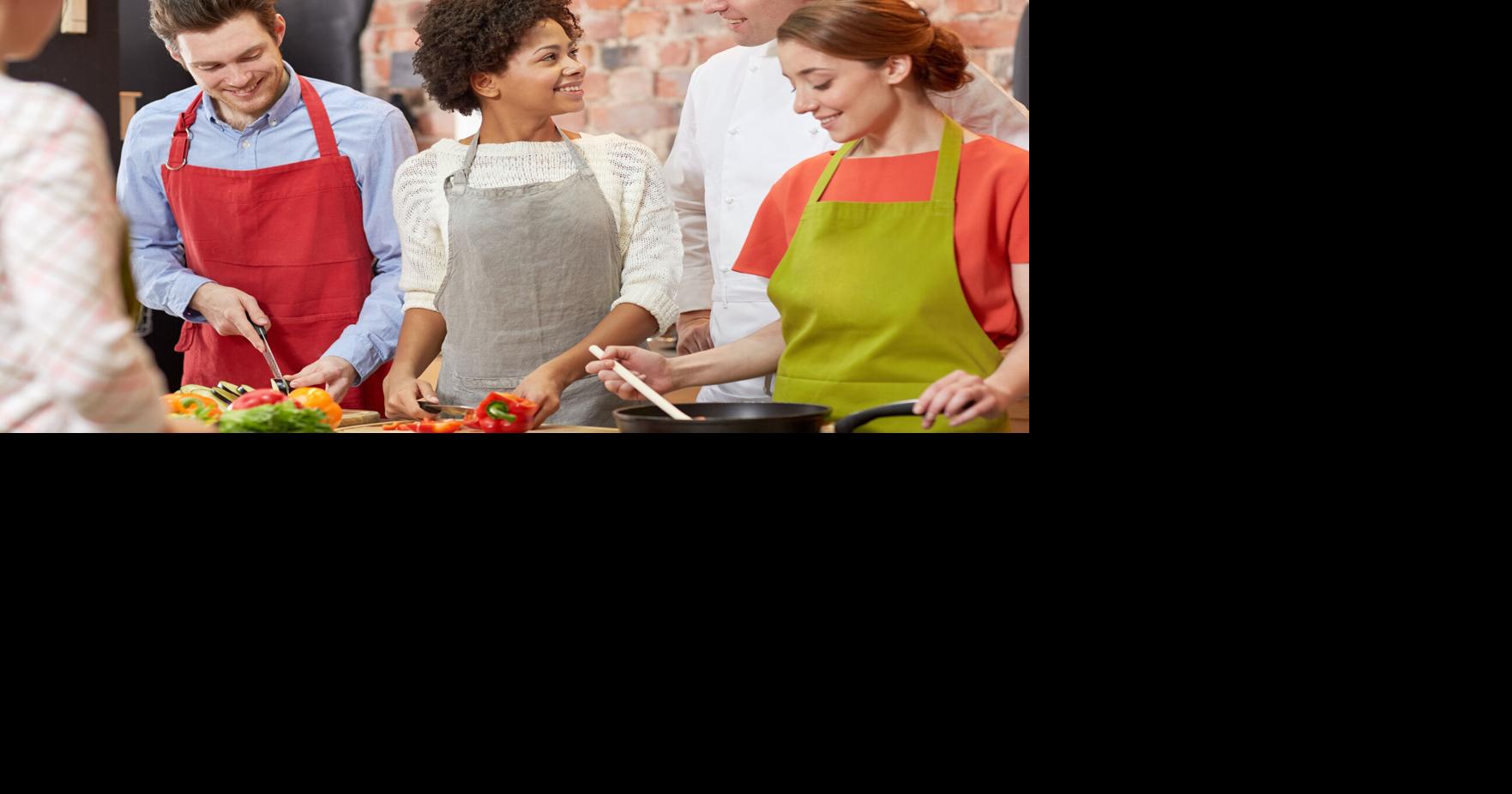 happy friends and chef cook cooking in kitchen
