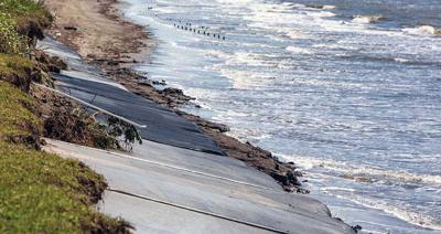 'In some parts there is no beach': Storm ate at island levee | Local ...