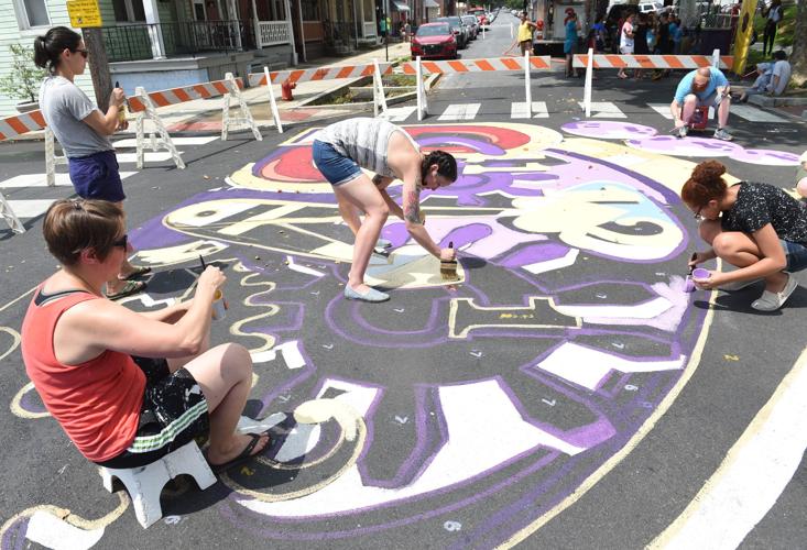 Artful intersection: residents were invited to help paint a community ...