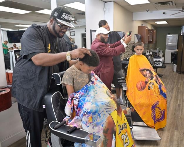Champ's Barber Shop and School celebrates 20th anniversary with free ...