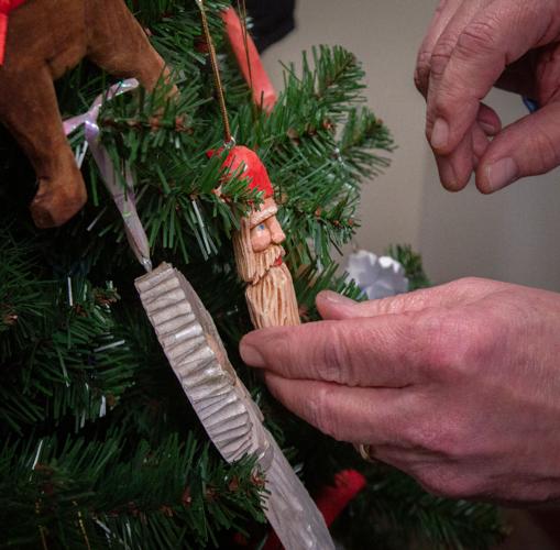 Woodcarvers decorate Hospice Christmas tree with carved ornaments ...