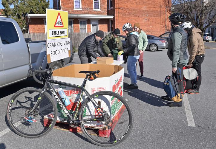 Lancaster bike lovers help gather Thanksgiving food items with ...