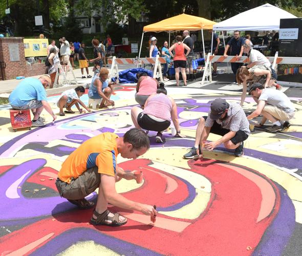 Artful intersection: residents were invited to help paint a community ...