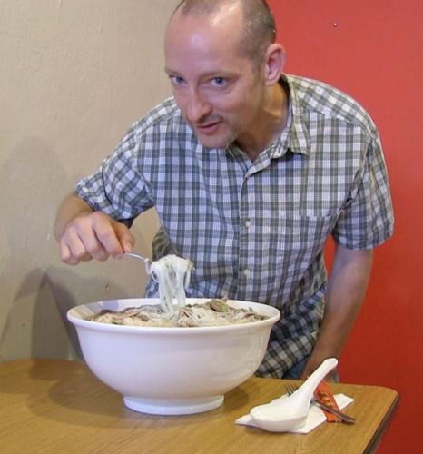 Belly Up: Staffer tries to find the bottom of a 5-pound bowl of pho ...
